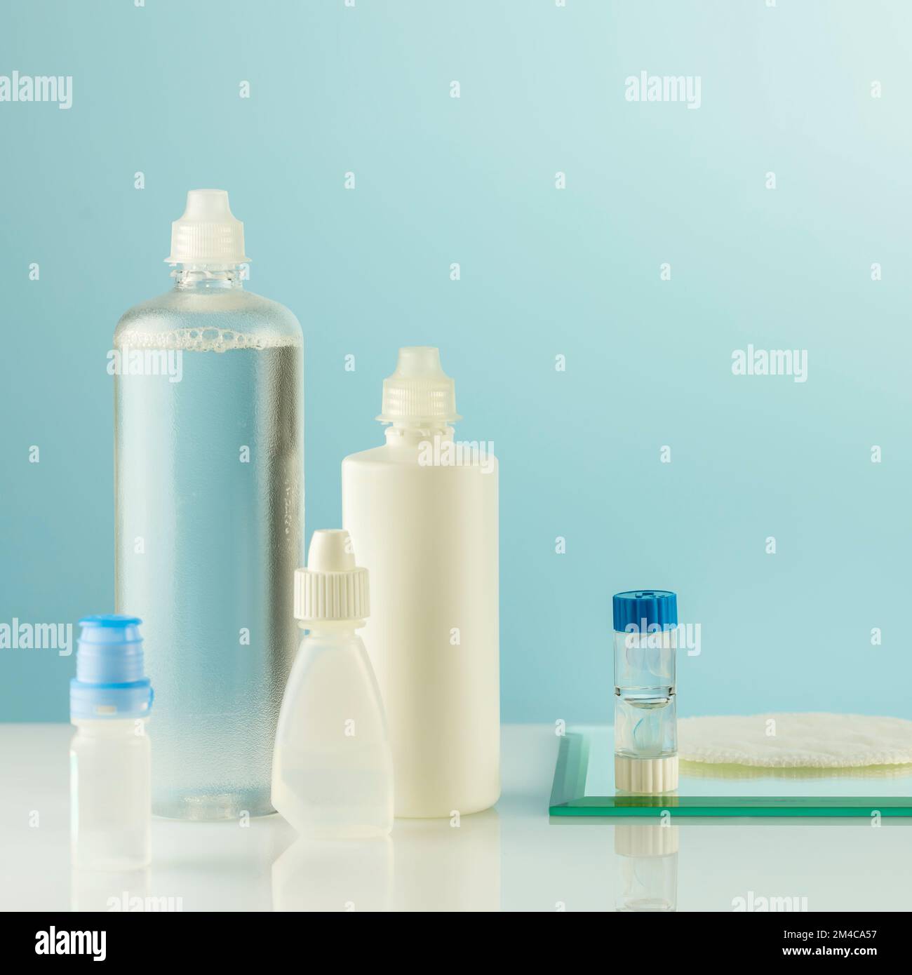 Oftalmology concept with container with contact lenses, moisturizing ...