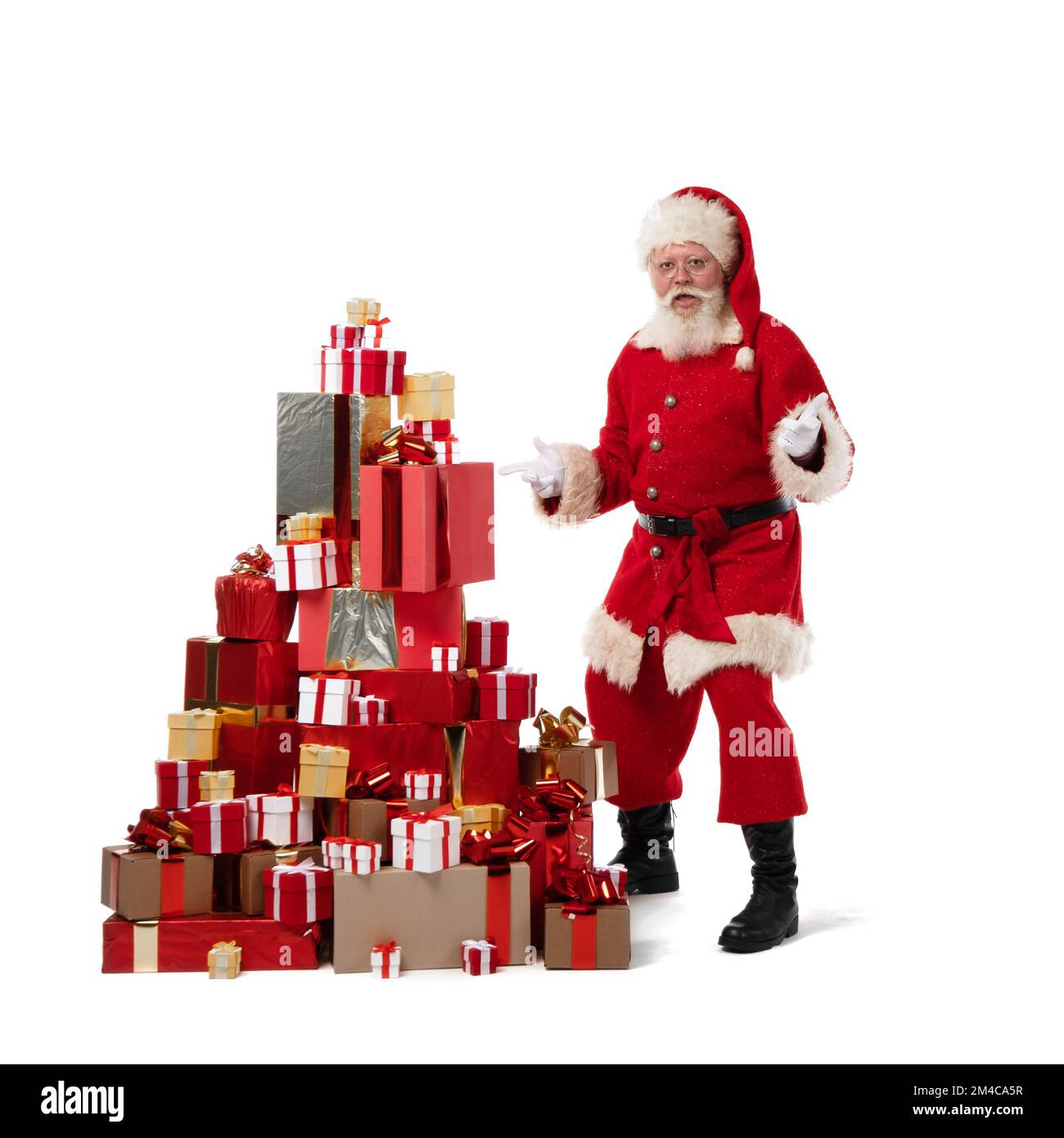 Santa Claus putting boxes into large pile of Christmas gifts isolated ...