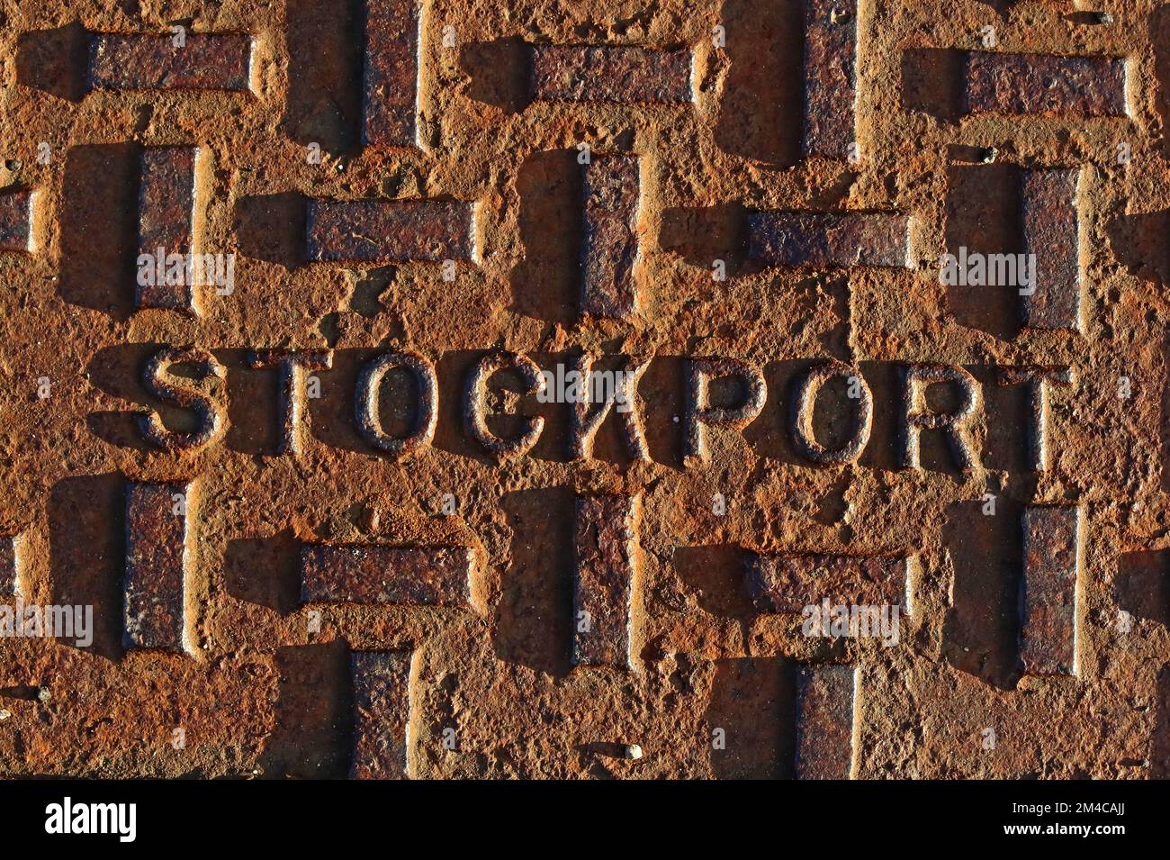 Stockport rusty cast iron grid, in evening sun Stock Photo - Alamy