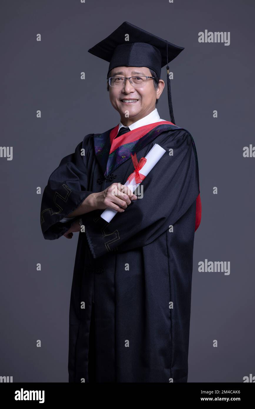 Senior Chinese student cheering for graduation Stock Photo - Alamy
