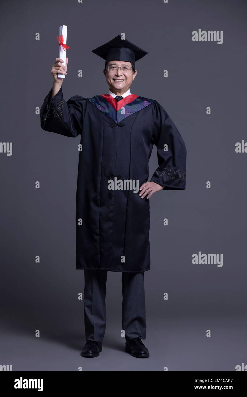 Senior Chinese student cheering for graduation Stock Photo - Alamy