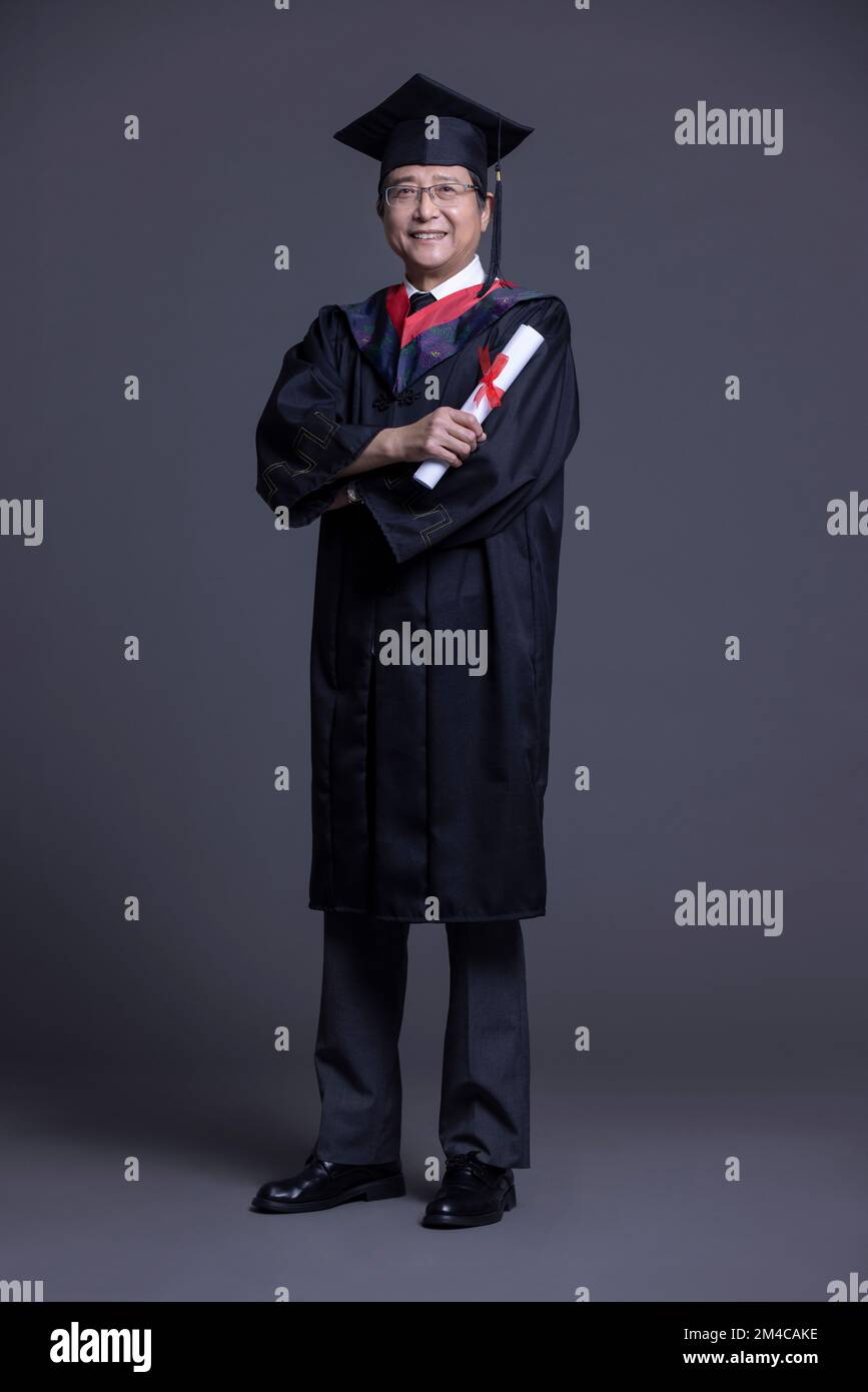 Senior Chinese student cheering for graduation Stock Photo - Alamy