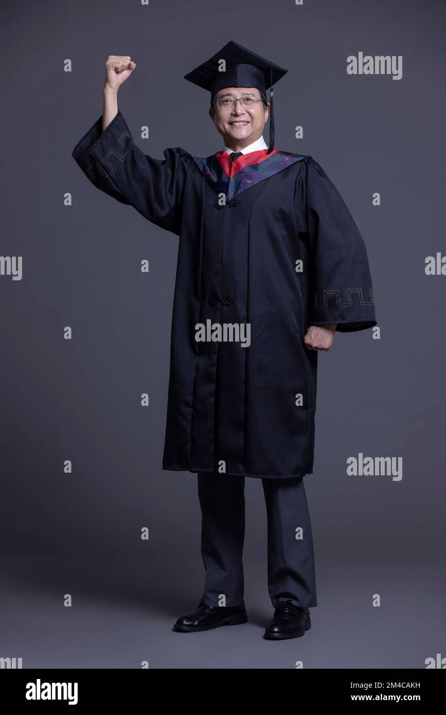 Senior Chinese student cheering for graduation Stock Photo - Alamy