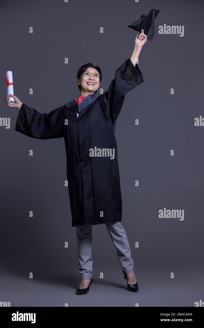 Senior Chinese student cheering for graduation Stock Photo - Alamy