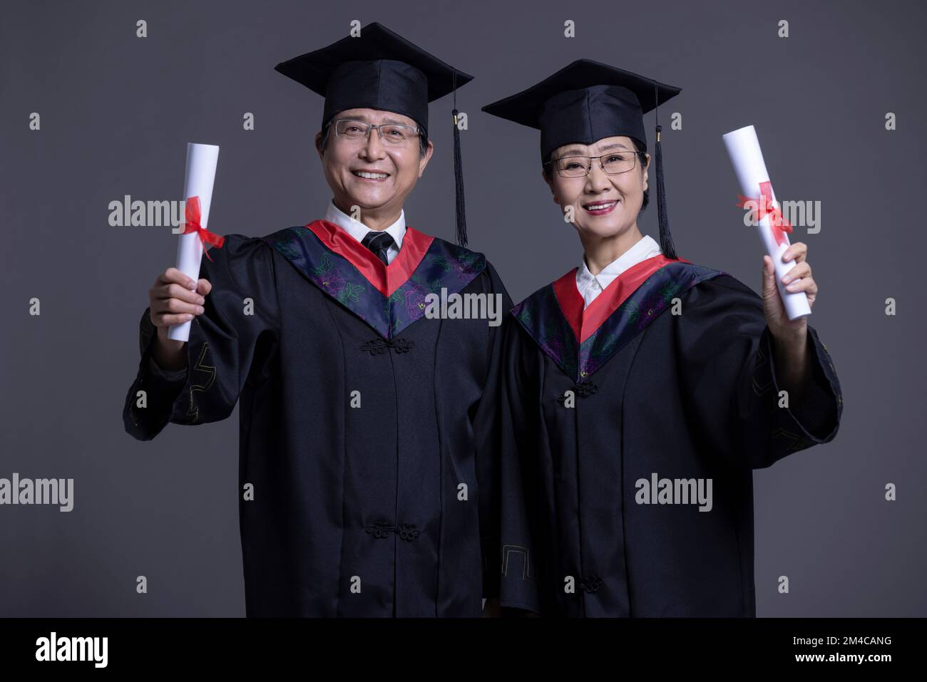 Senior Chinese students cheering for graduation Stock Photo - Alamy