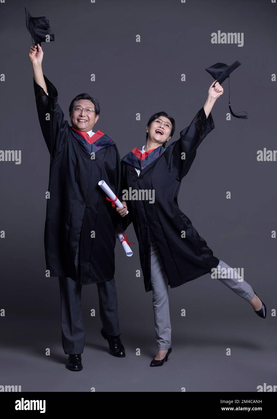 Senior Chinese students cheering for graduation Stock Photo - Alamy