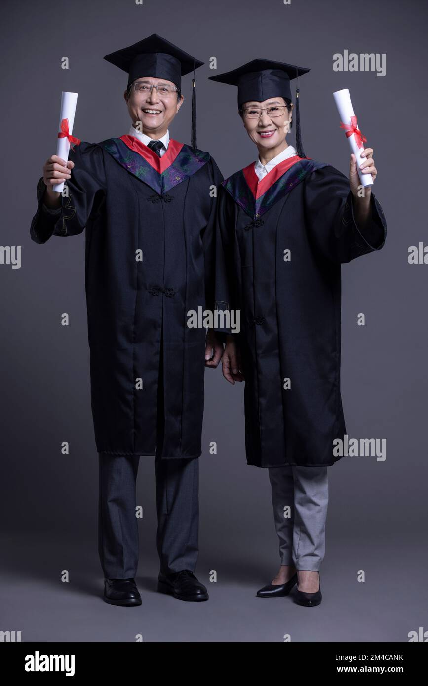 Senior Chinese students cheering for graduation Stock Photo - Alamy