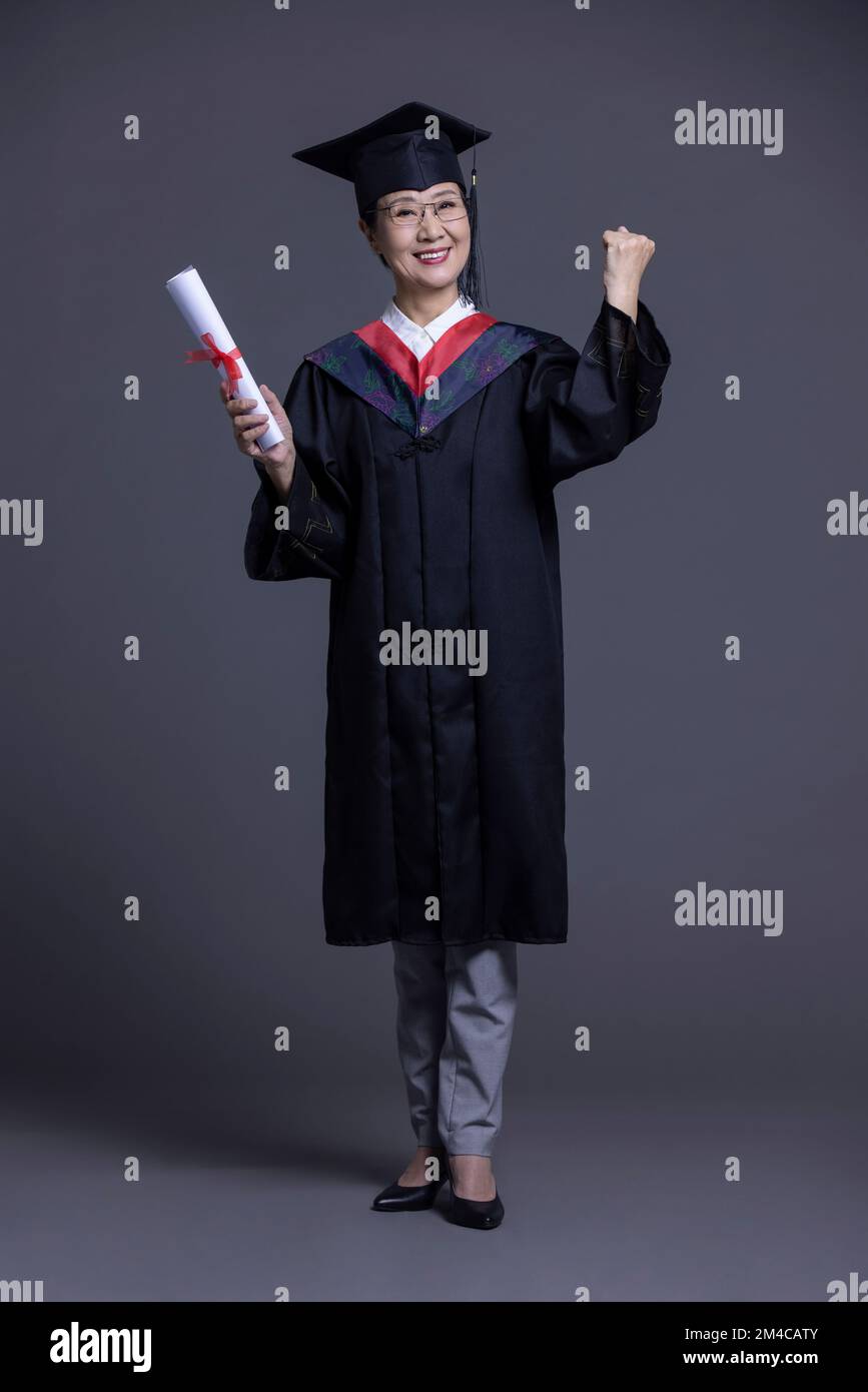 Senior Chinese student cheering for graduation Stock Photo - Alamy