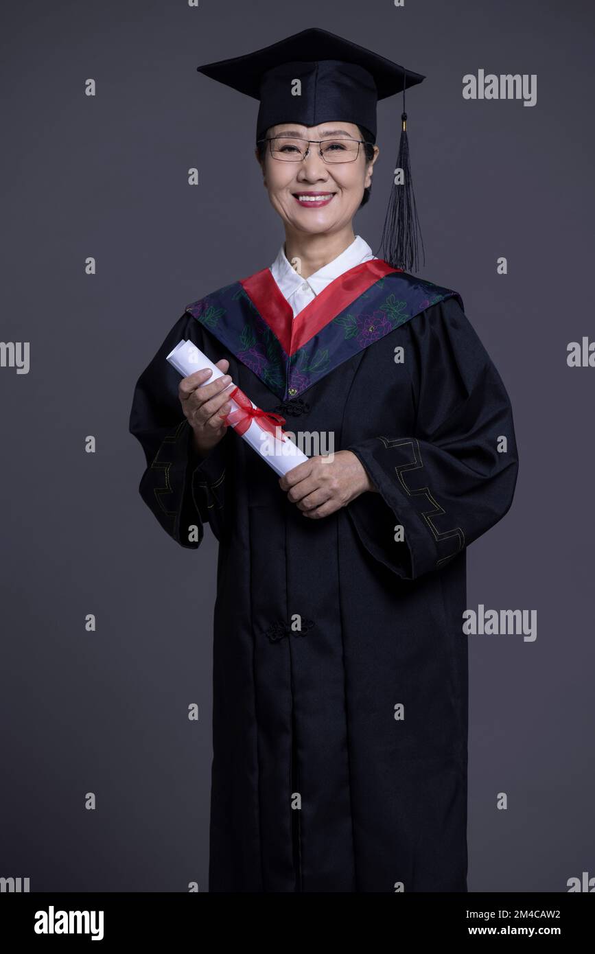 Senior Chinese student cheering for graduation Stock Photo - Alamy