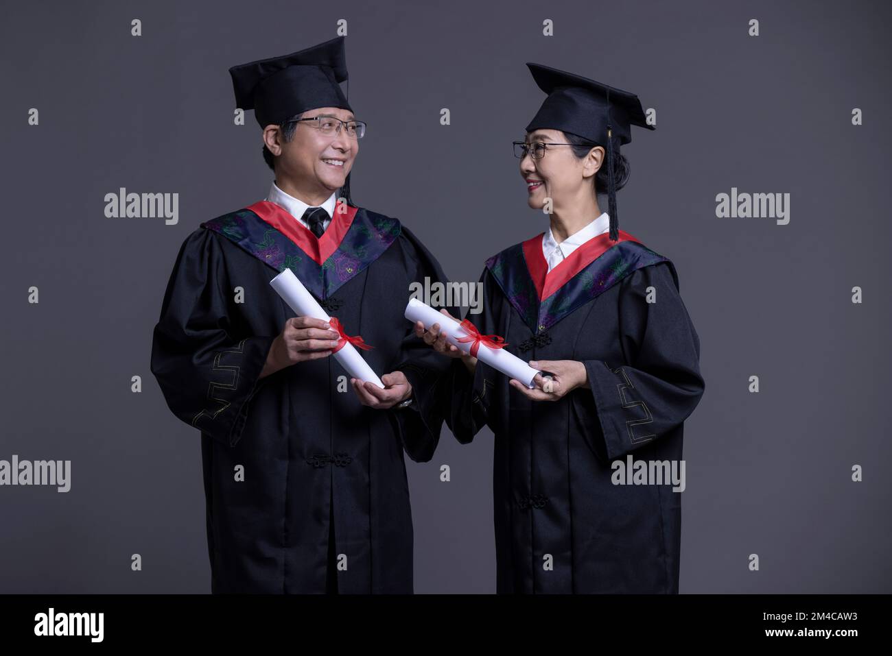 Senior Chinese students cheering for graduation Stock Photo - Alamy