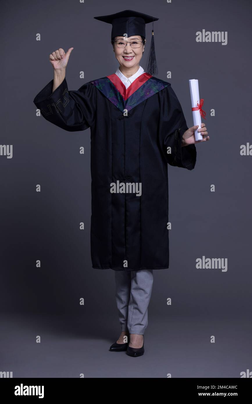 Senior Chinese student cheering for graduation Stock Photo - Alamy