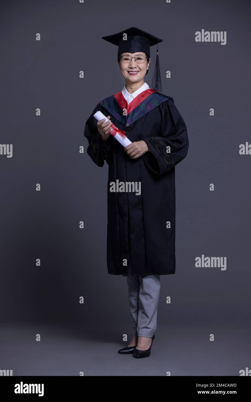 Senior Chinese student cheering for graduation Stock Photo - Alamy