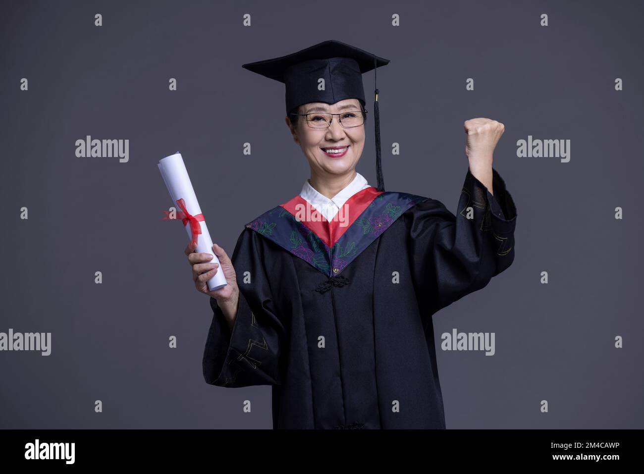 Senior Chinese student cheering for graduation Stock Photo - Alamy