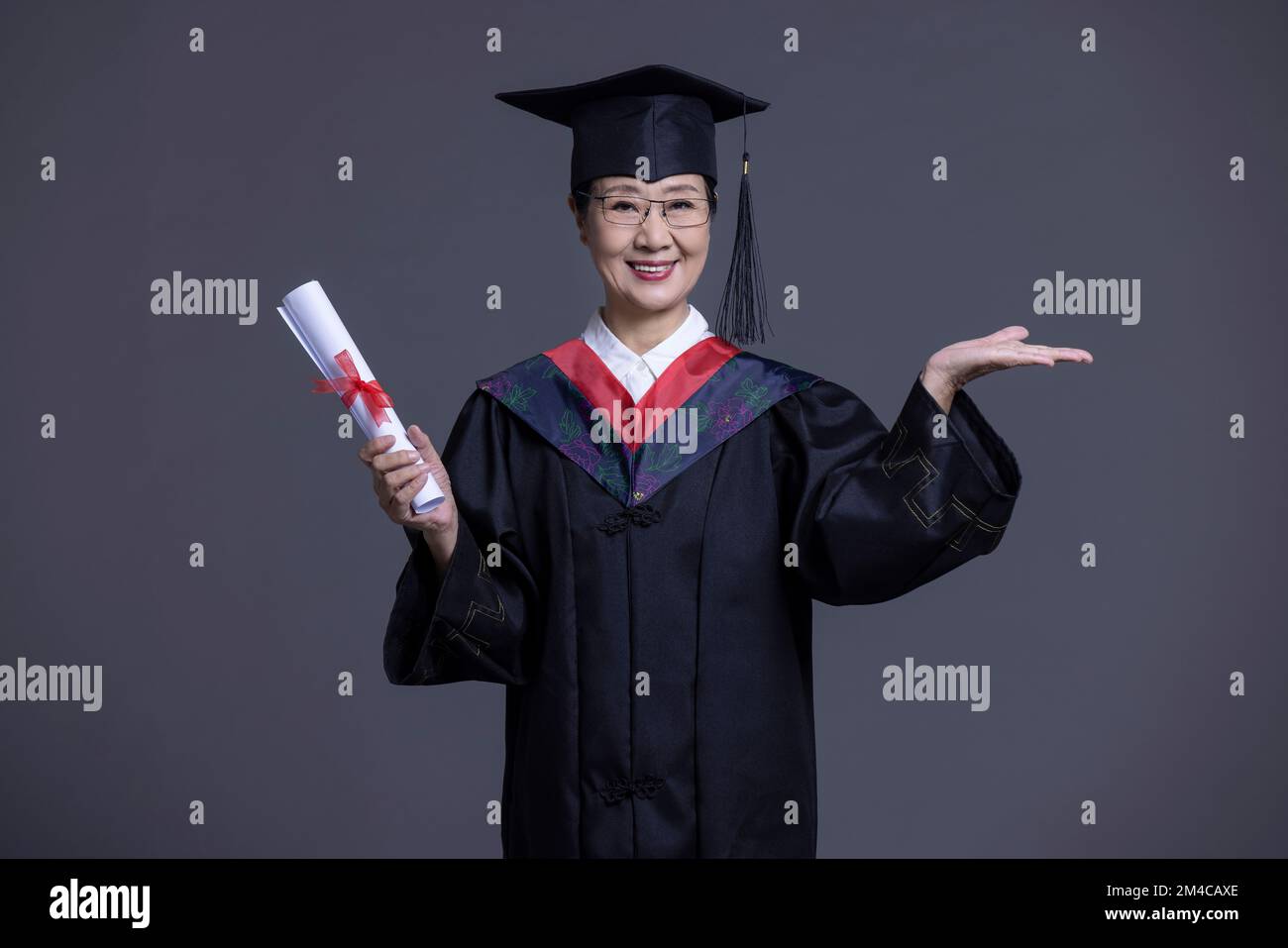 Senior Chinese student cheering for graduation Stock Photo - Alamy