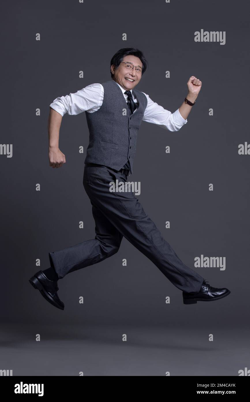 Running mid air senior hi-res stock photography and images - Alamy