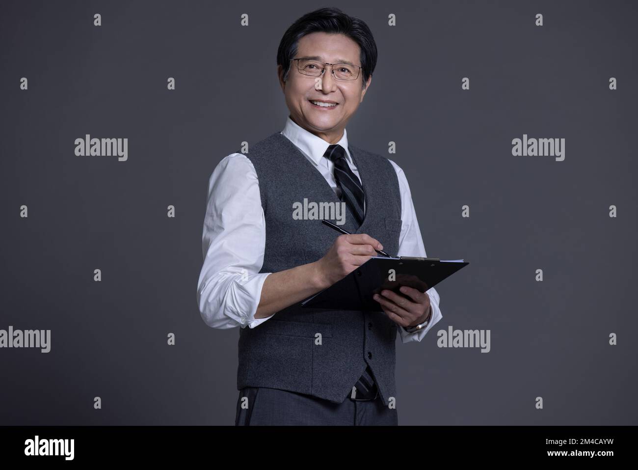 Portrait of confident Chinese businessman Stock Photo - Alamy