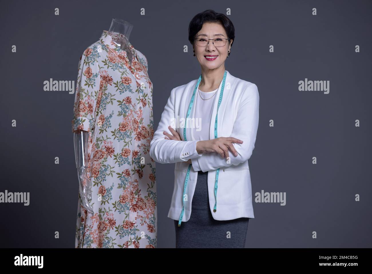 Elegant Chinese fashion designer working Stock Photo - Alamy