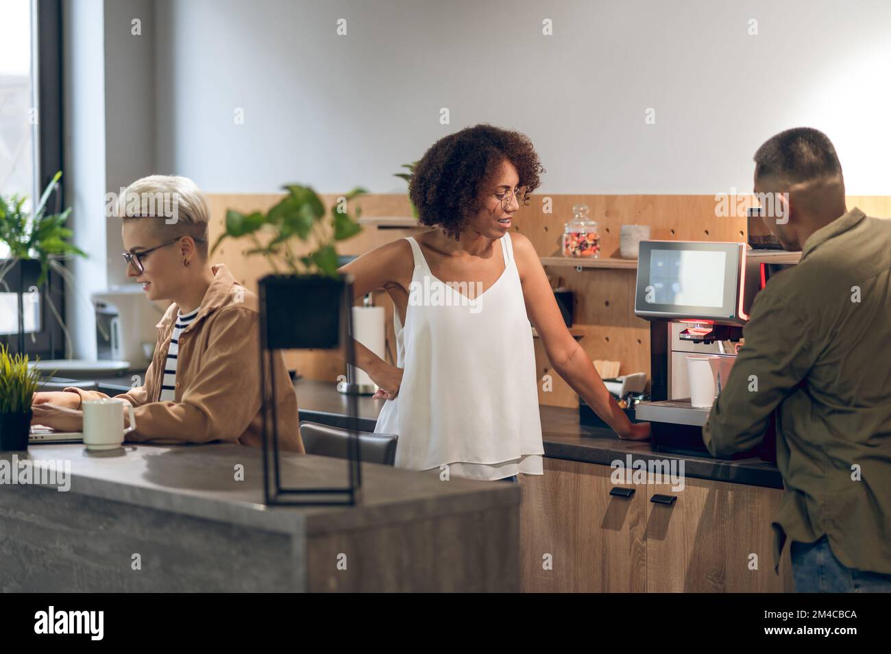 Office kitchen man woman coffee hi-res stock photography and images - Alamy