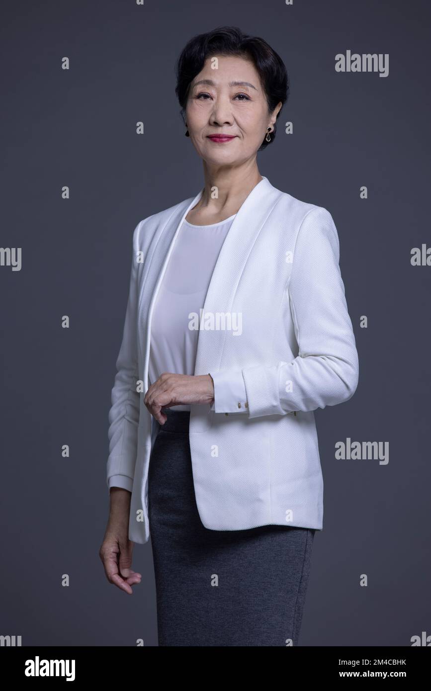 Asian senior woman skirt hi-res stock photography and images - Alamy