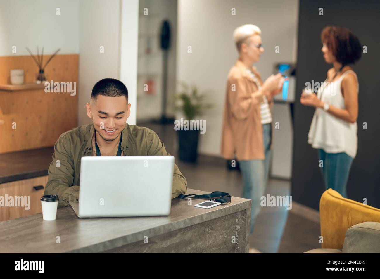 Busy corporate worker and his coworkers in the company office Stock ...