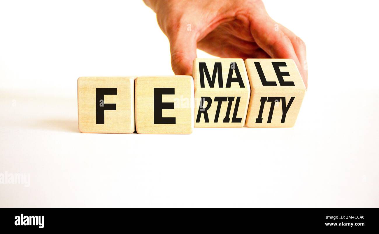 Female fertility symbol. Concept word Female fertility on wooden cubes ...