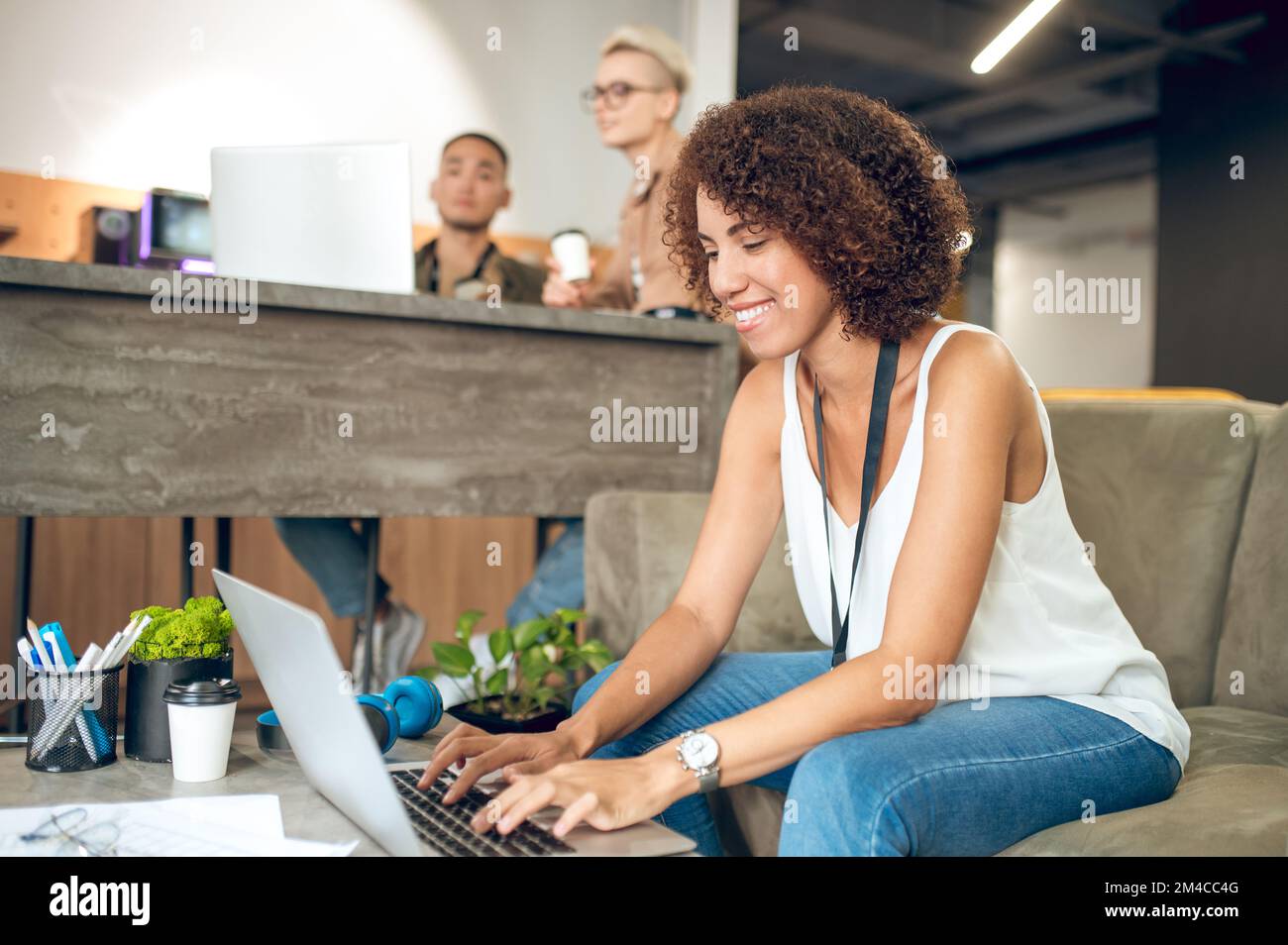 Company employees engaged in work in a modern office Stock Photo - Alamy