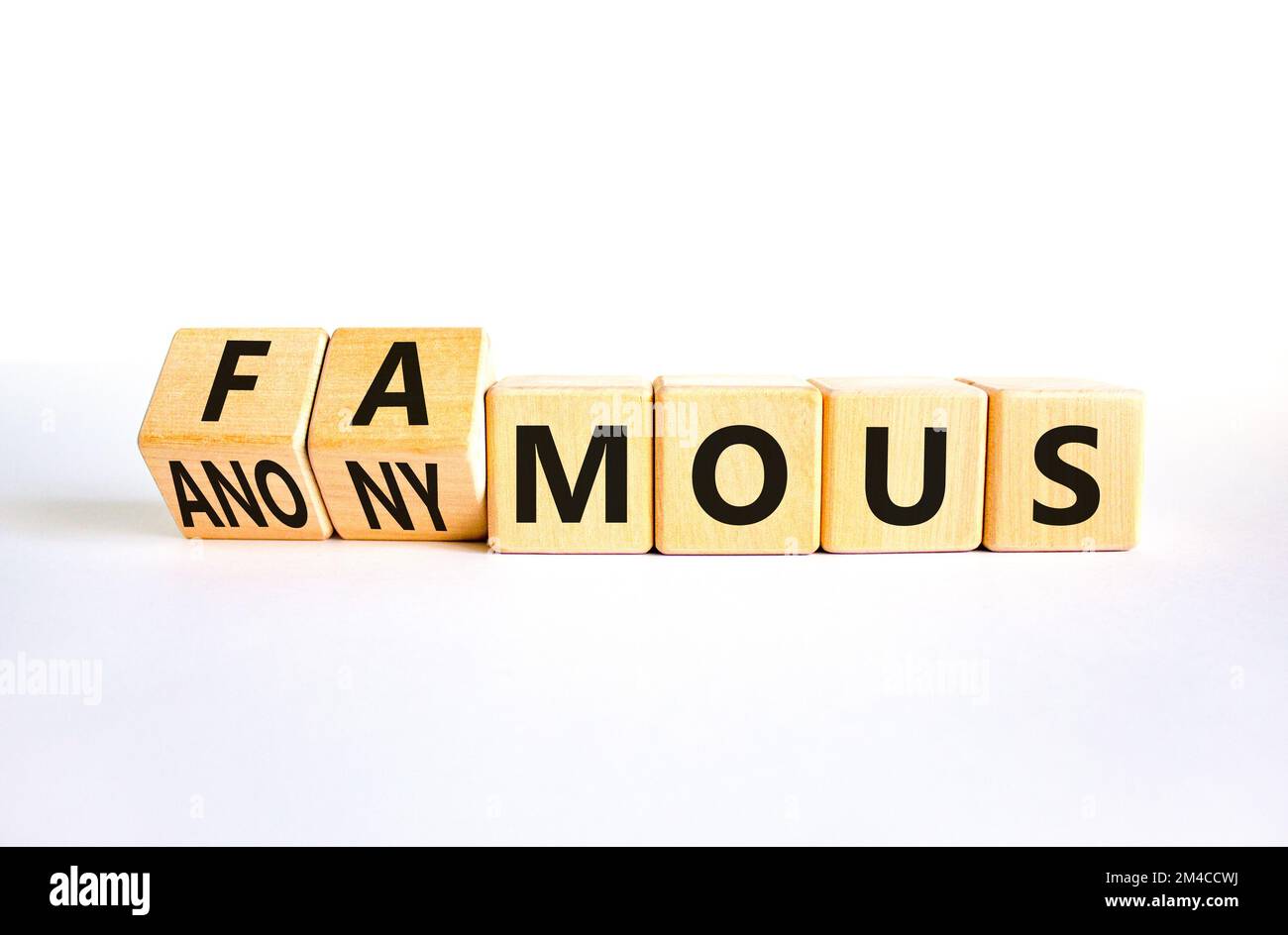 Famous or anonymous symbol. Concept word Famous and Anonymous on wooden ...