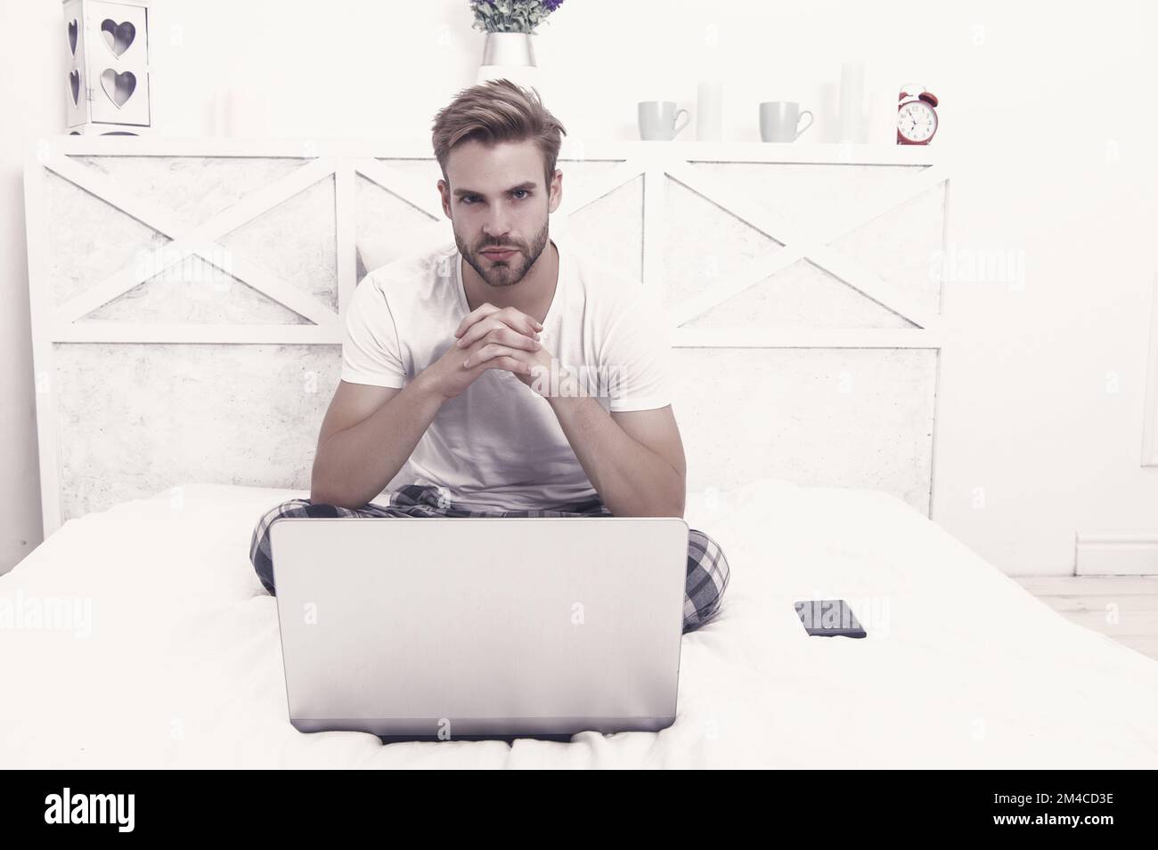 Handsome guy use computer digital technology for working from home ...