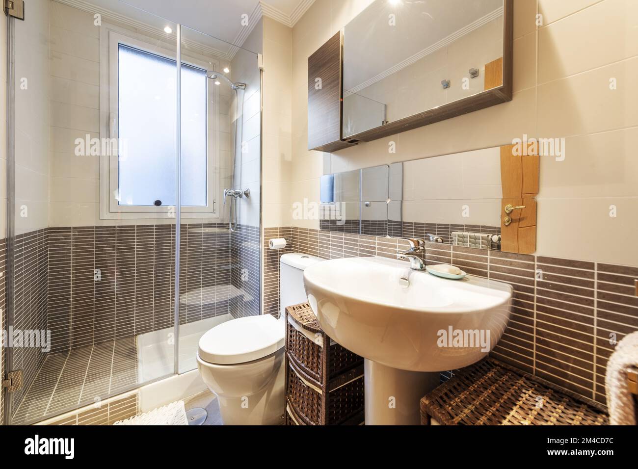 Bathroom With wooden furniture with integrated mirror hanging on the ...
