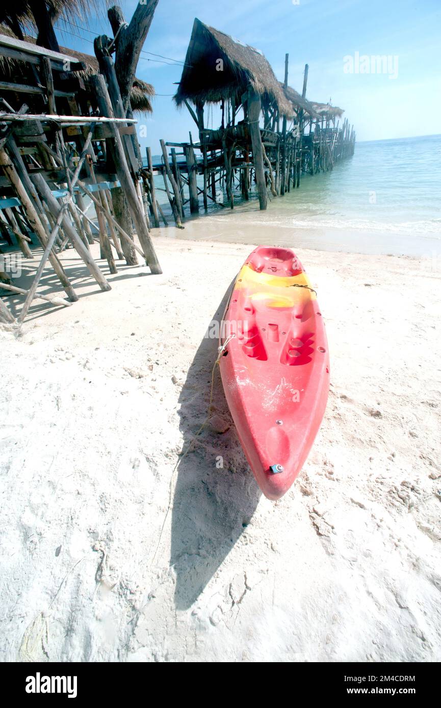 Colorful canoes near the wooden bridge at Ao Lung Dam beach on Koh ...