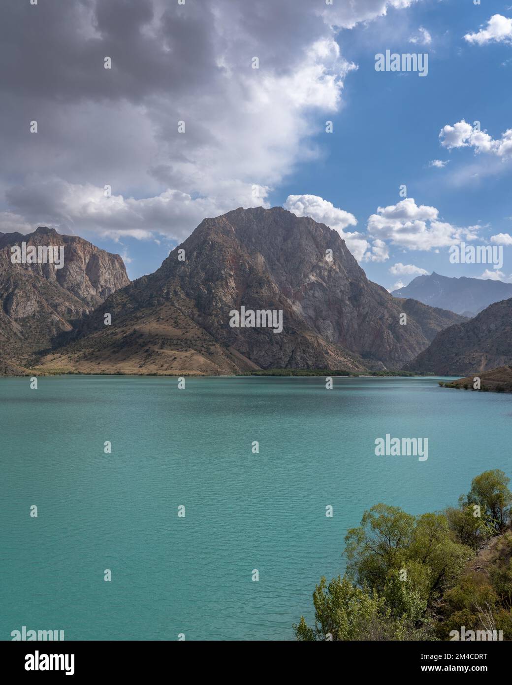 Scenic vertical landscape view of popular landmark Iskanderkul lake ...