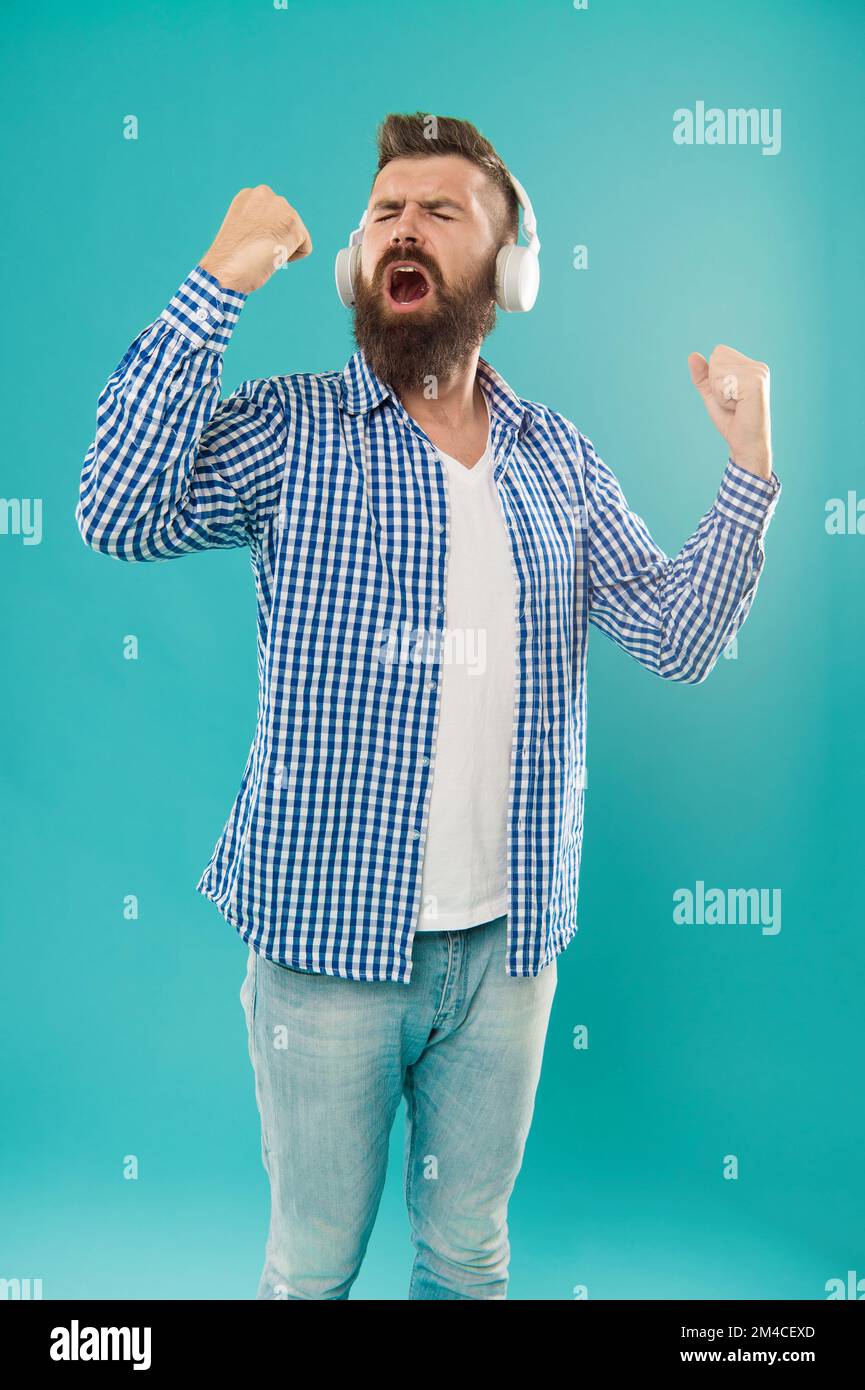 classical music lover. guy with beard and moustache wear headphones ...