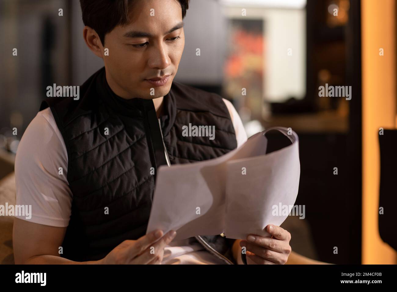 Chinese mid adult man reading files Stock Photo - Alamy Chinese mid adult man reading files Stock Photo - Alamy