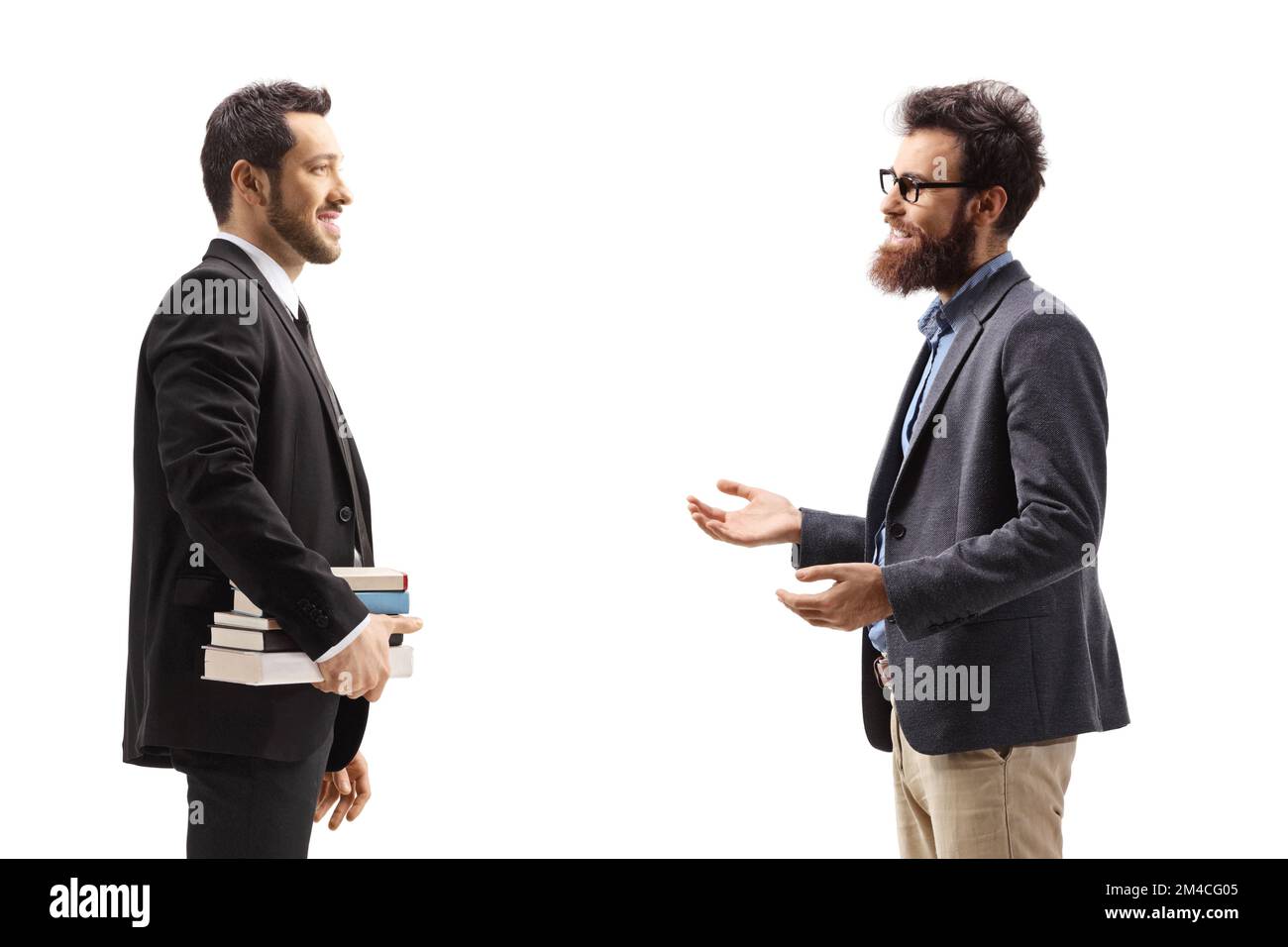 Profile shot of two male teachers standing and talking isolated on ...