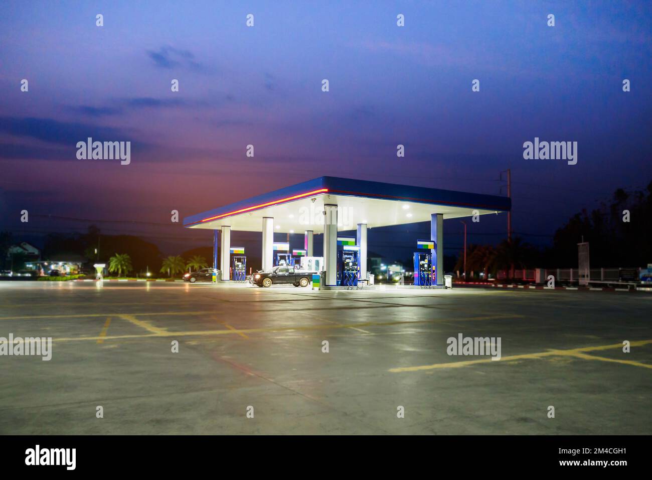 gas station with clouds and sky at sunset Stock Photo - Alamy