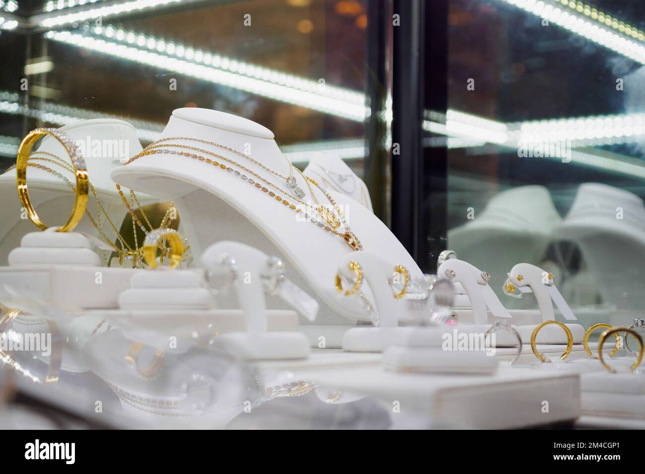 Gold jewelry diamond shop with bracelet rings and necklaces in luxury ...