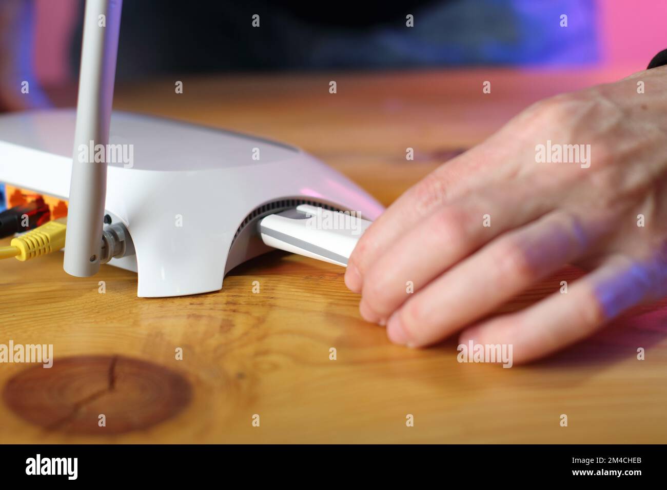 inserting gsm modem into router with antennas on plank table by sosba ...