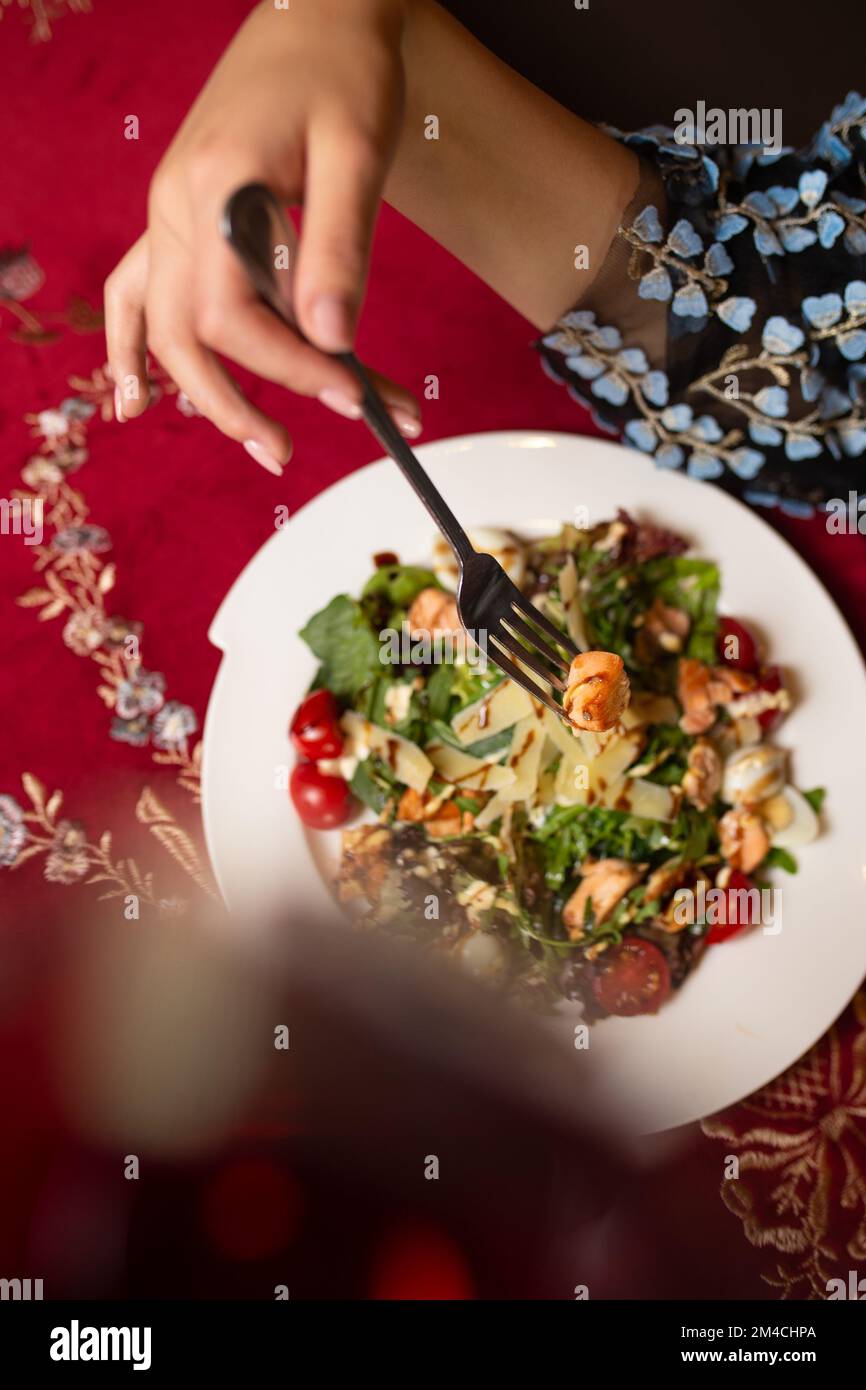 Female hands fork eating salad hi-res stock photography and images - Alamy