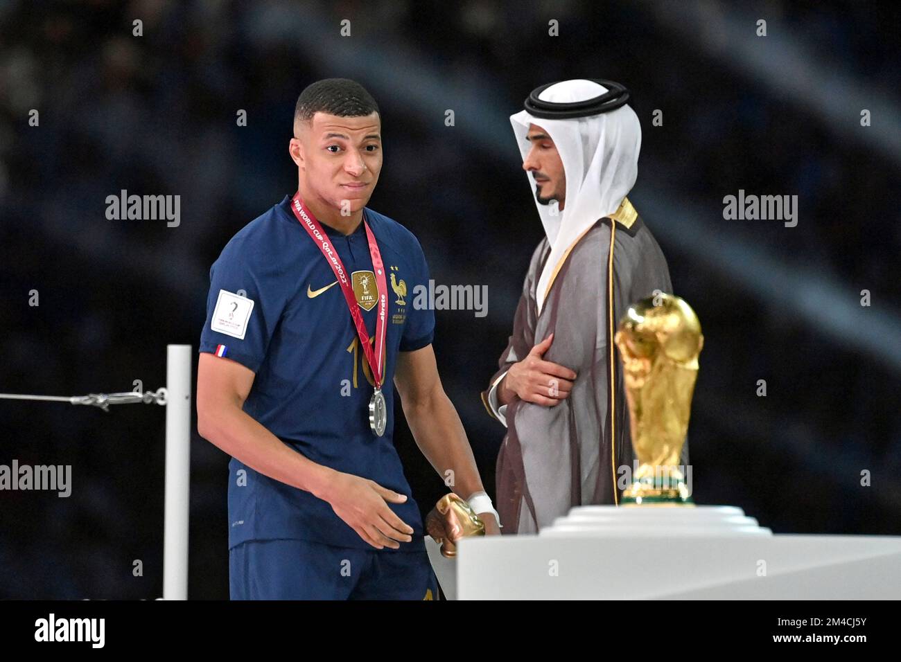 Award ceremony: Kylian MBAPPE (FRA) walks past the trophy, cup, trophy ...