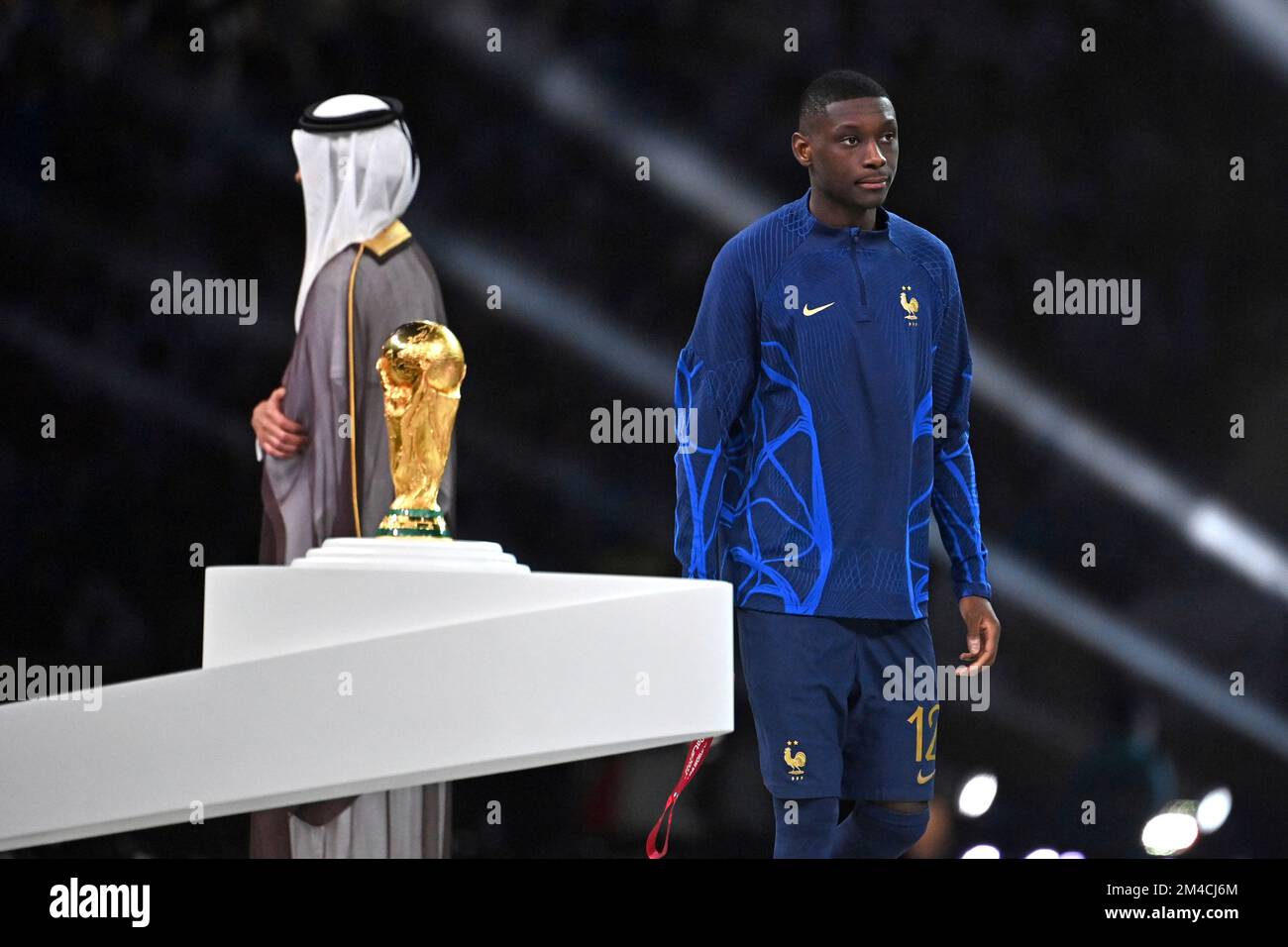 Award ceremony: KOLO MUANI Randal (FRA) walks past the trophy, cup ...