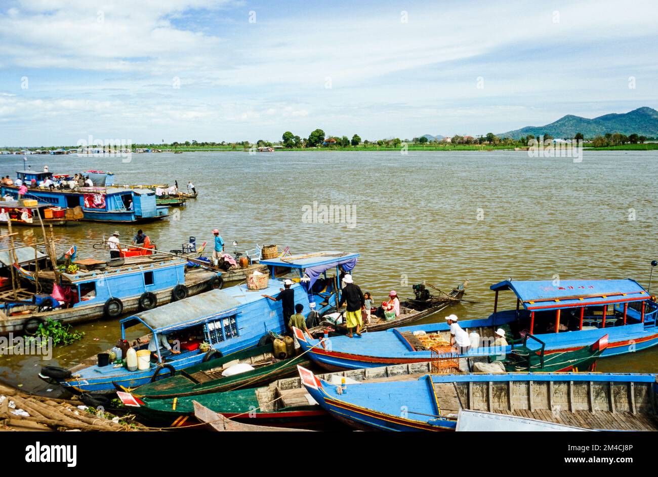 Boots are the way to carry goods across the Tonle Sap River Stock Photo ...