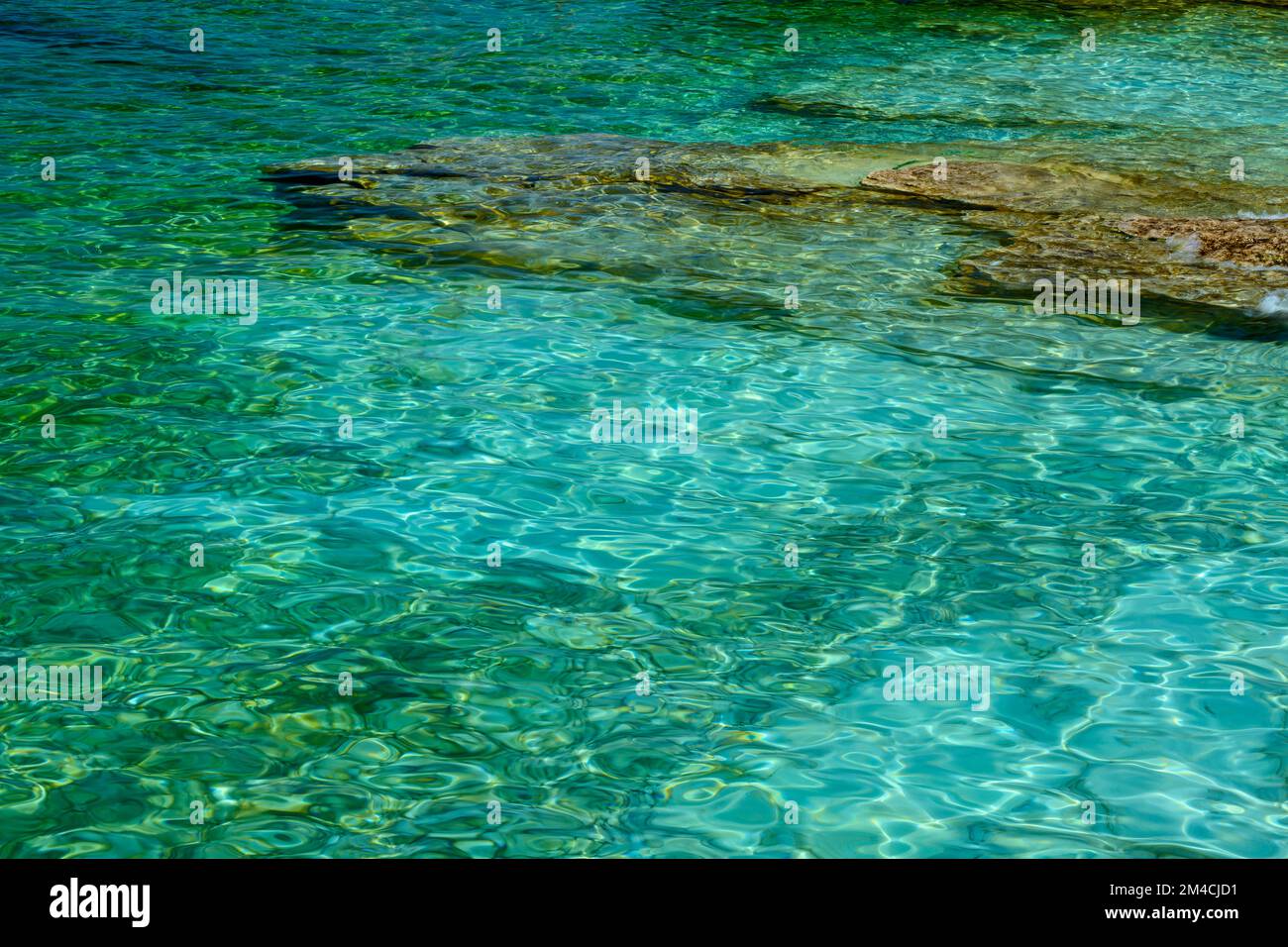 Sunlit water, rocks along the Lake Huron shoreline, Bruce Peninsula ...