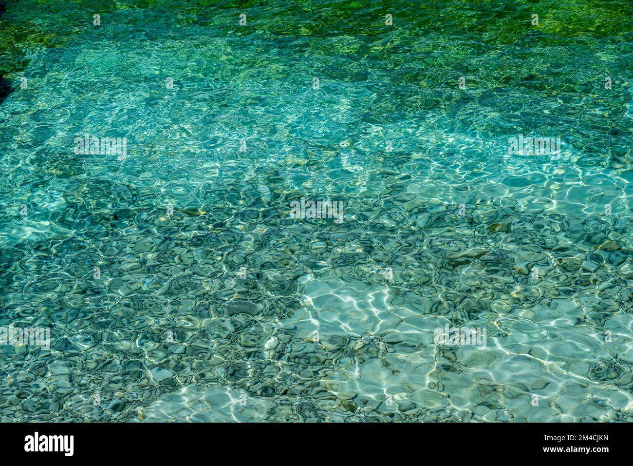 Sunlit water, rocks along the Lake Huron shoreline, Bruce Peninsula ...