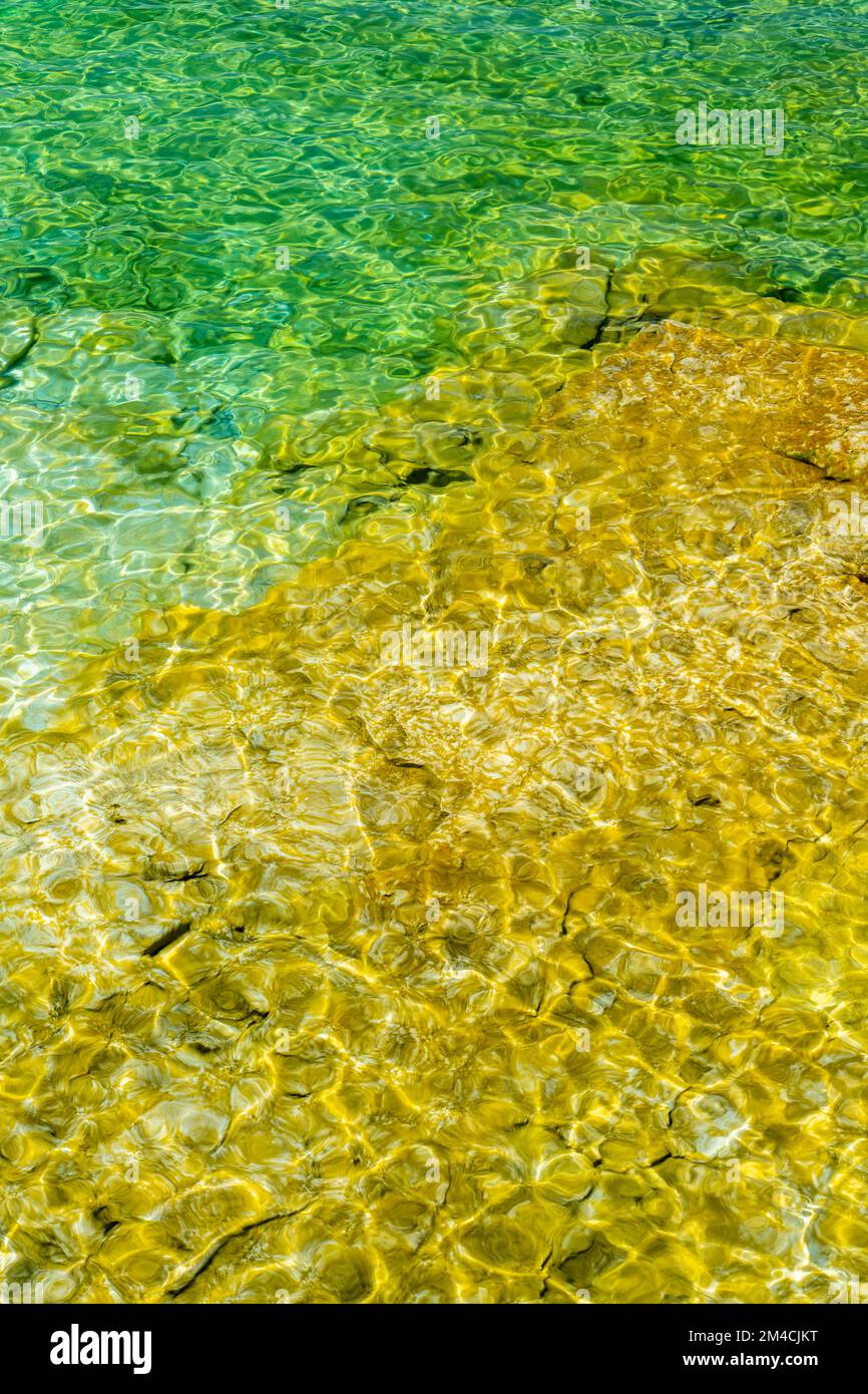 Sunlit water, rocks along the Lake Huron shoreline, Bruce Peninsula ...