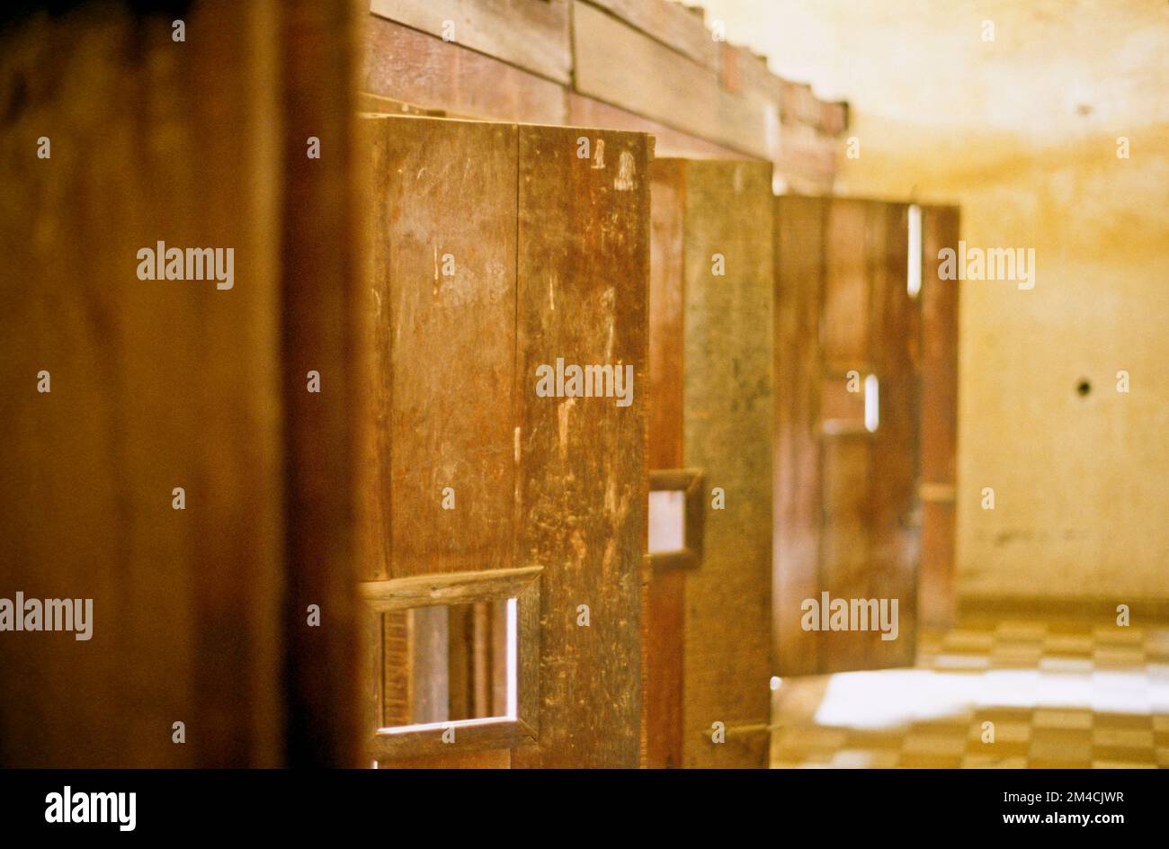 Prison cell doors in the Tuol Sleng Genocide Museum, former Tuol Svay ...