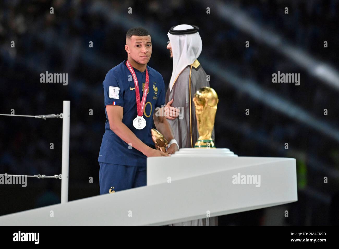 Award ceremony: Kylian MBAPPE (FRA) walks past the trophy, cup, trophy ...