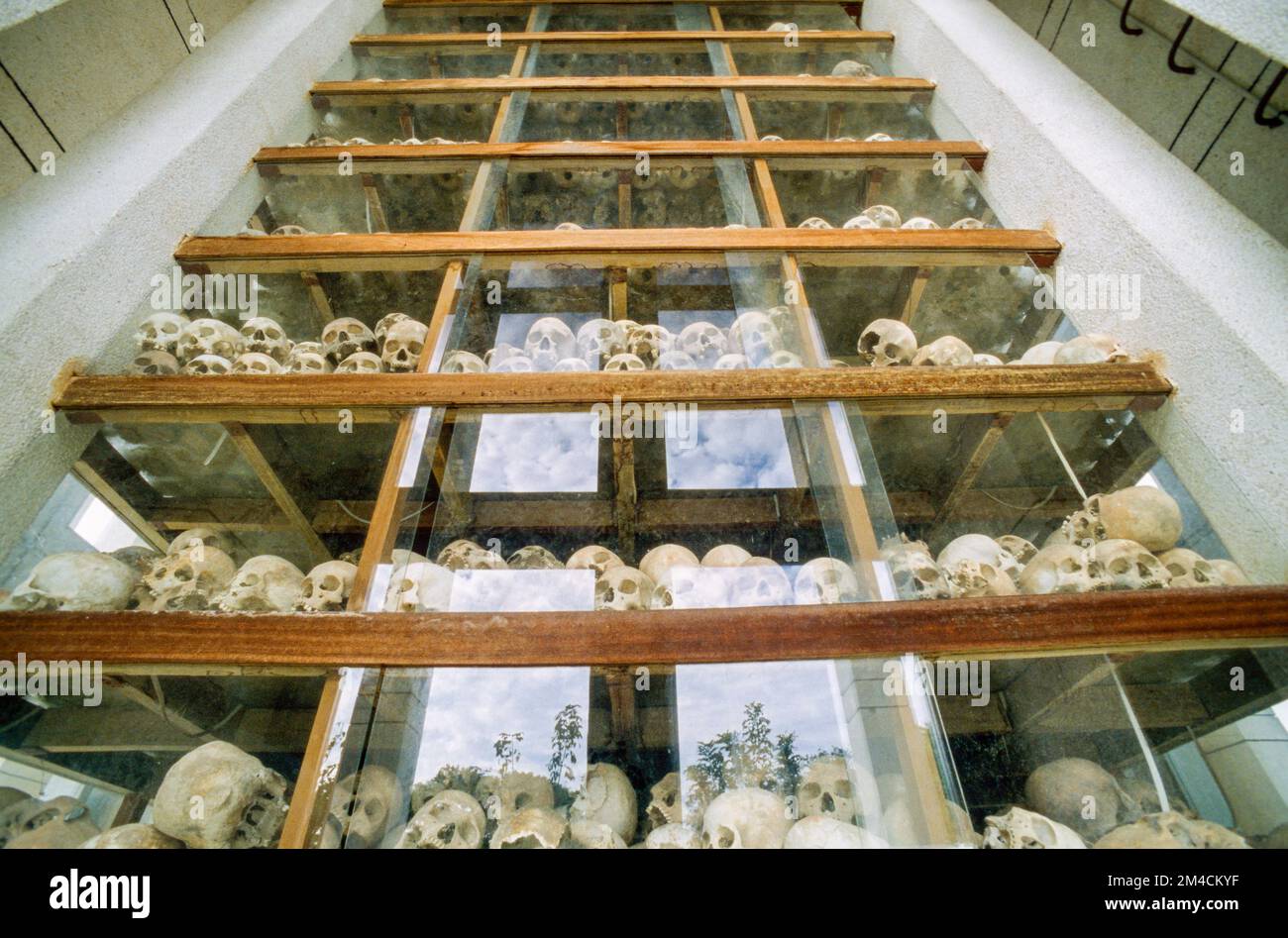 Victims skulls in shelfes exhibited in the Tuol Sleng Genocide Museum ...