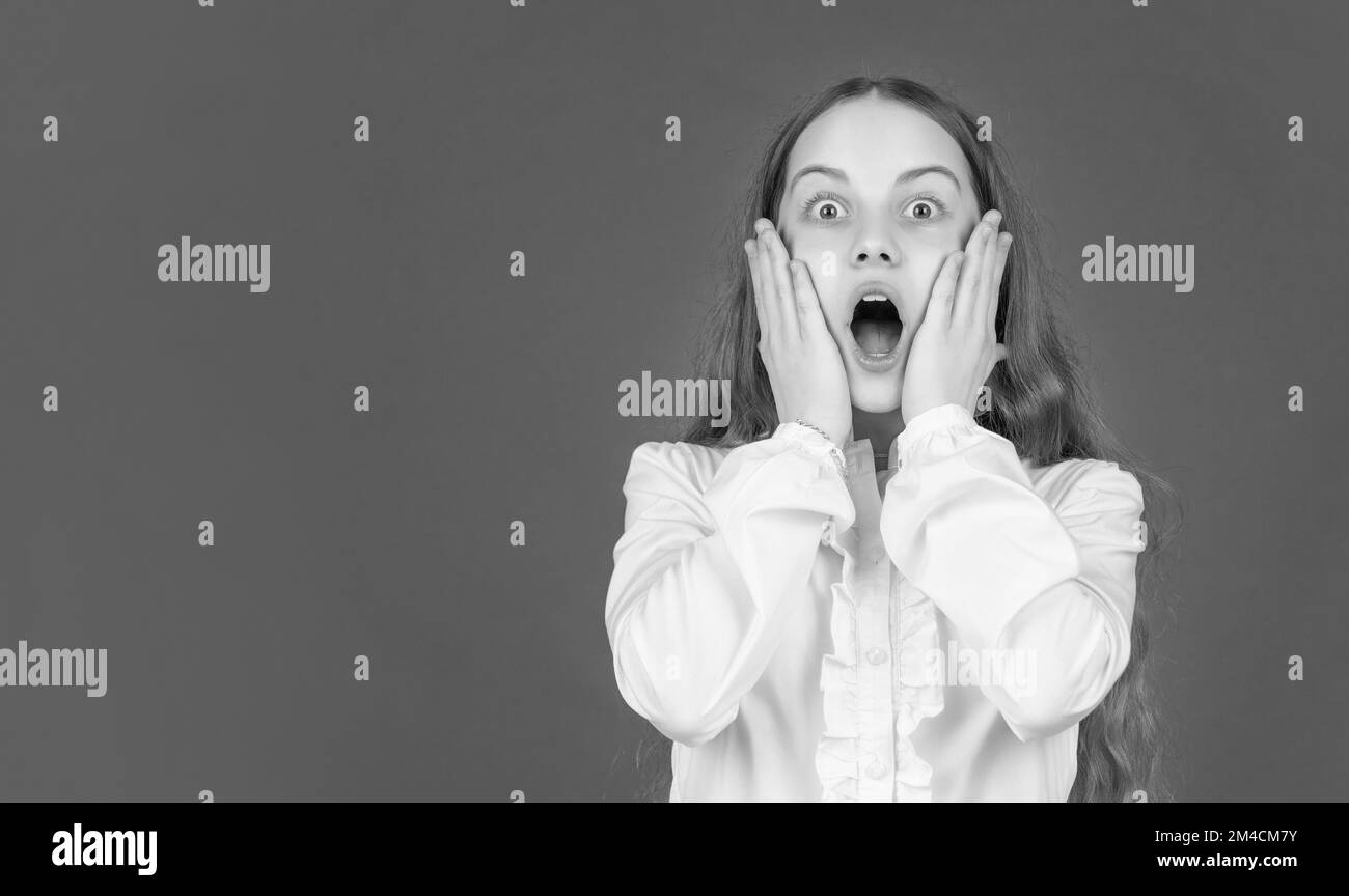 shocking news. kid in white shirt on red background. childhood ...