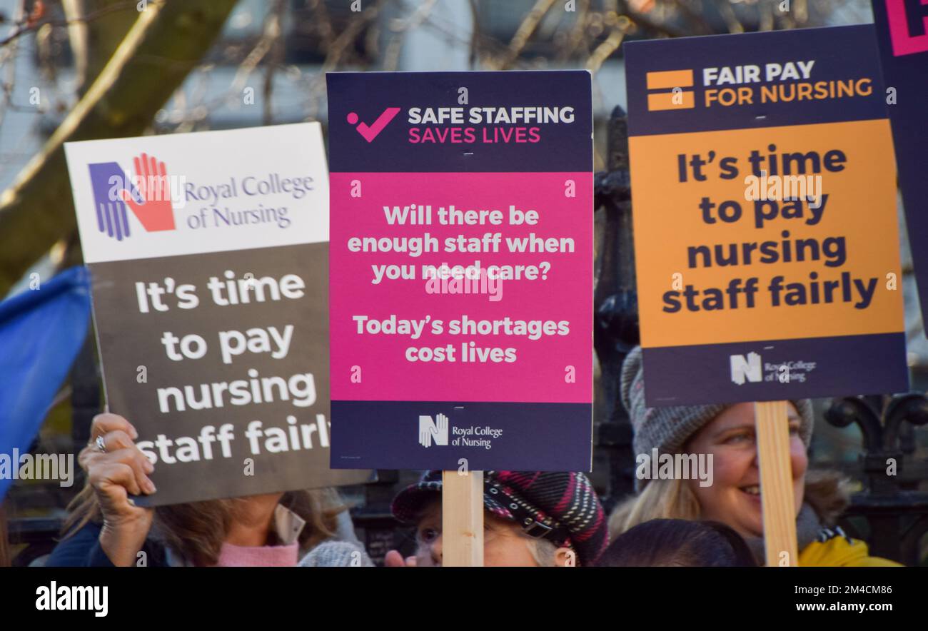 London, UK. 20th Dec, 2022. Nurses hold placards in support of fair pay ...