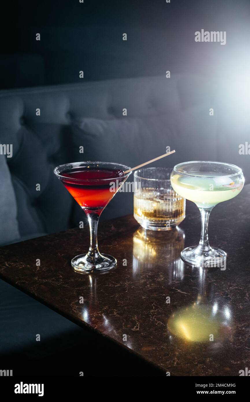 alcoholic cocktails on the stone table in the bar Stock Photo - Alamy